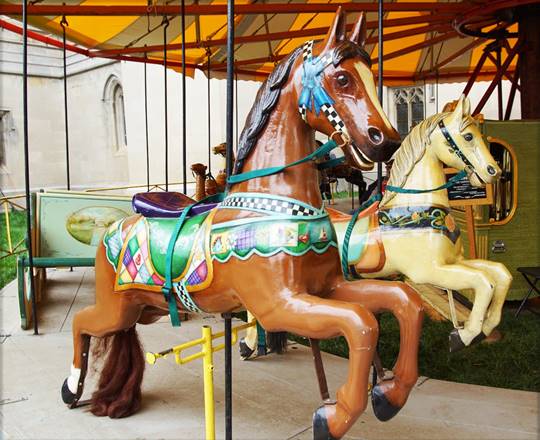 A picture containing floor, carousel, rideDescription automatically ...