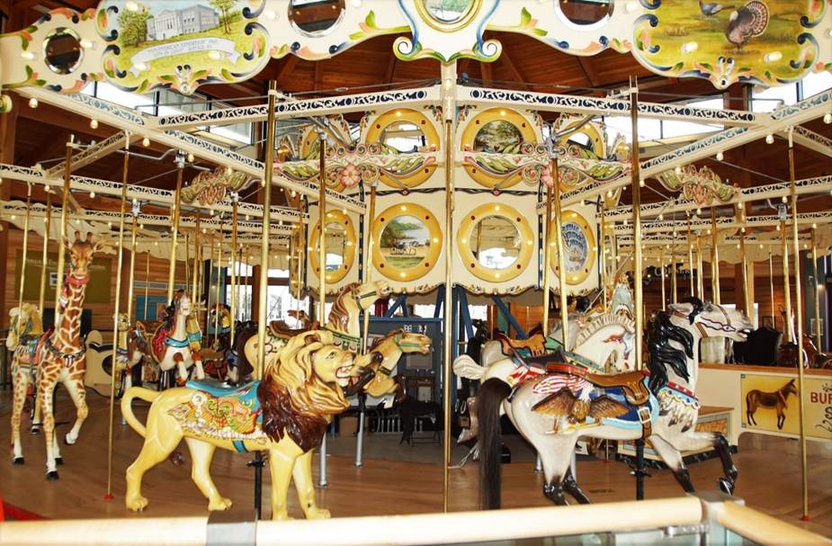 A picture containing carousel, outdoor object, ride, indoorDescription ...