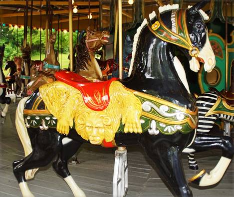 A picture containing carousel, ride, amusement ride, amusement ...