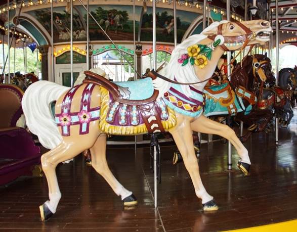 A chair sitting in front of a carouselDescription automatically generated