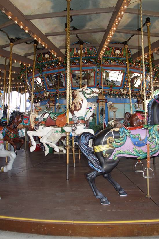 A group of people in a carouselDescription generated with high confidence